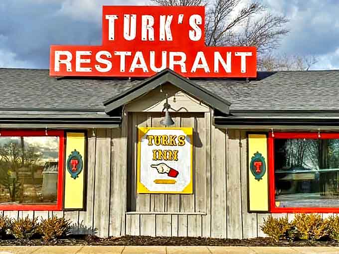 The iconic red sign of Turk's Restaurant stands out against the rustic wooden exterior, beckoning hungry travelers with a promise of homestyle comfort.