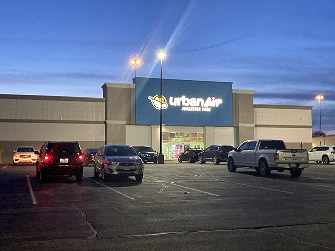 The glowing Urban Air sign beckons like a beacon of bouncy salvation in the Akron night, promising adventures that'll make your fitness tracker send concerned messages.