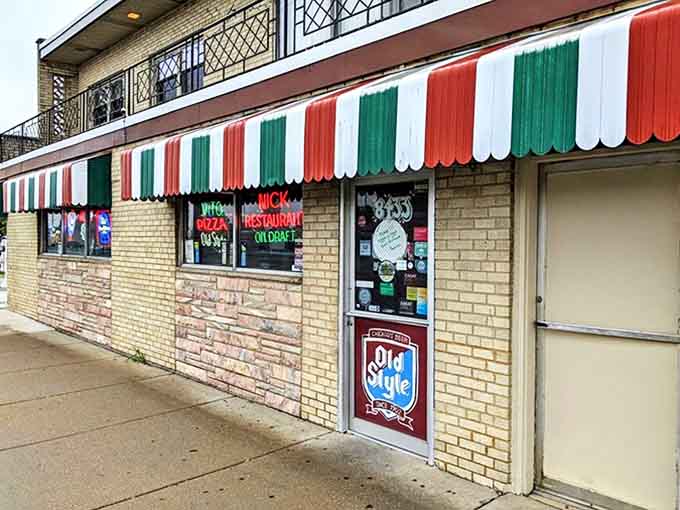 The iconic red, white, and green striped awning announces Vito & Nick's presence on Chicago's South Side like an Italian flag waving proudly since 1932.