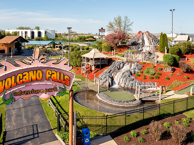 Welcome to erupting fun! Volcano Falls Adventure Park's iconic entrance promises adventure with its vibrant colors and tropical-themed landscape.