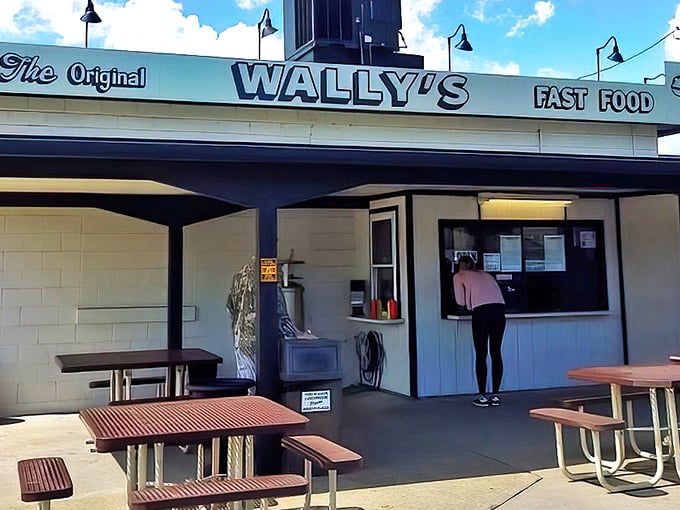 The iconic white facade of Wally's stands as a beacon to burger lovers, promising simple perfection since 1951.