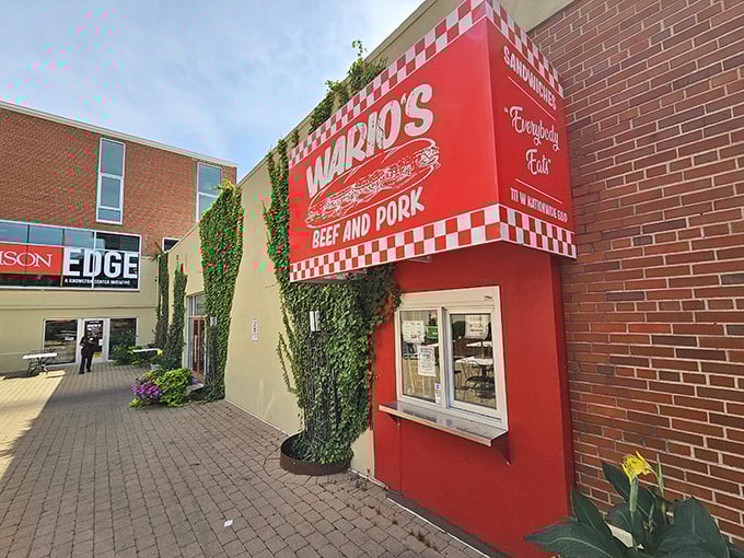 Wario's Beef & Pork: That vibrant red storefront with checkerboard trim isn't just eye-catching—it's a beacon calling sandwich lovers home.