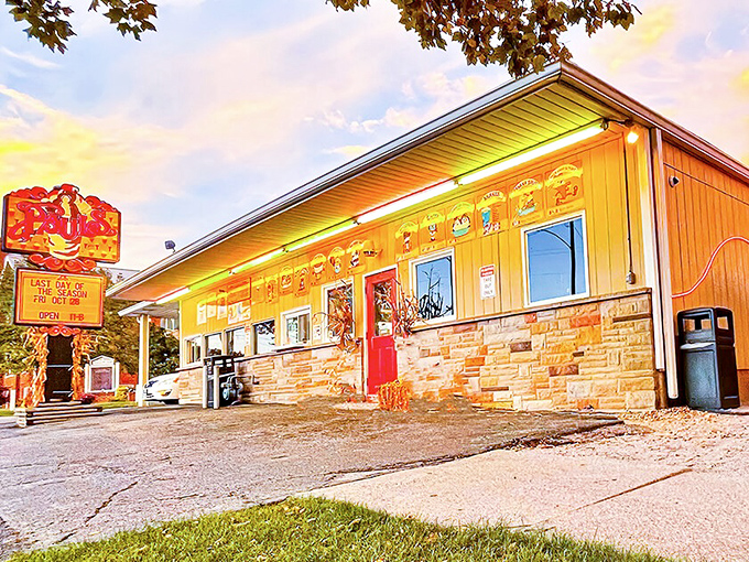 The sunshine-yellow exterior of Paul's Drive-In glows like a beacon of hope for hungry travelers, promising classic American comfort in every bite.