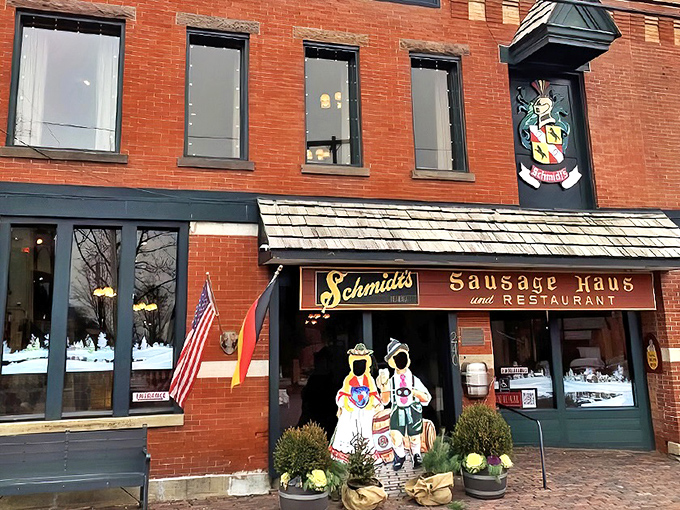 The iconic red brick fa&ccedil;ade of Schmidt's Sausage Haus welcomes visitors with old-world charm and the promise of authentic German flavors.