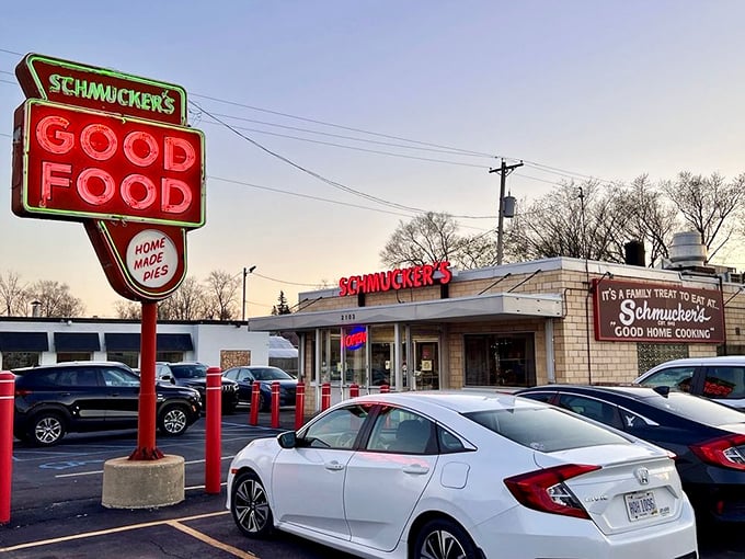 Exterior: The iconic red "GOOD FOOD" sign stands tall against the sky, a neon beacon that's been guiding hungry travelers to burger paradise since the Truman era.