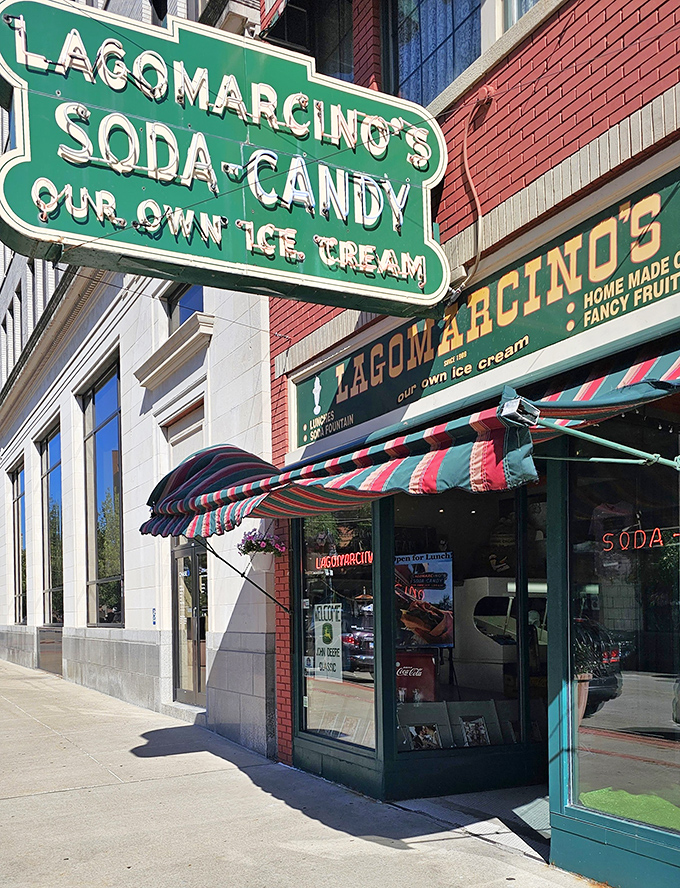 The iconic green sign of Lagomarcino's beckons sweet-toothed pilgrims like a beacon of sugary salvation in downtown Moline, promising treats that transcend time.