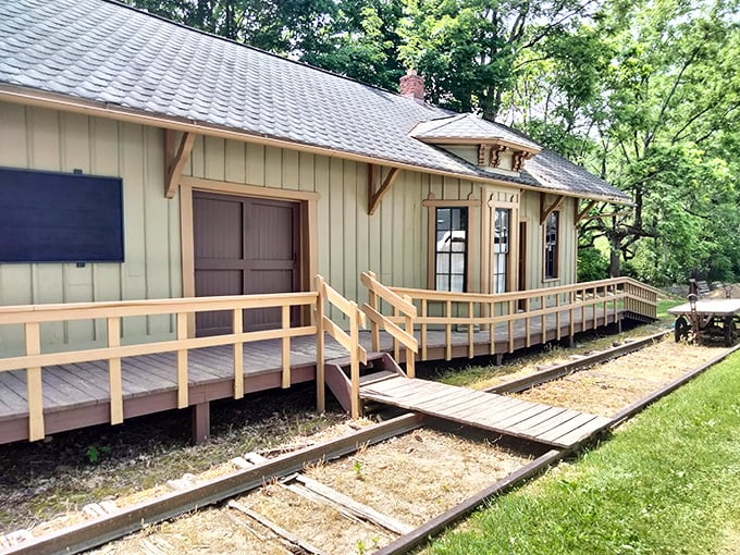 The restored train depot welcomes visitors with its weathered wooden charm, standing as a gateway to Ohio's rural past.