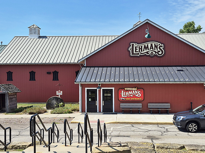 The iconic red barn exterior of Lehman's stands proudly against the Ohio sky, promising treasures that transcend time and trends.