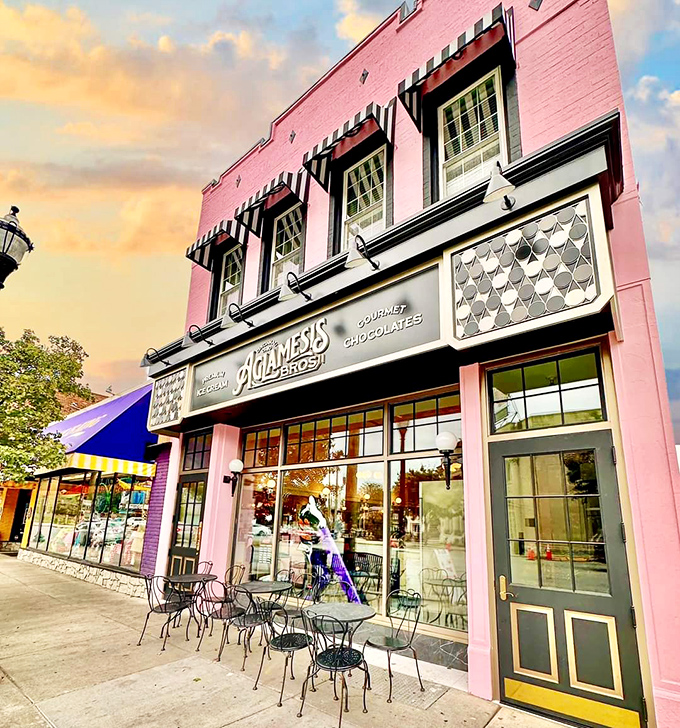 The iconic pink facade of Aglamesis Brothers stands like a sweet beacon on Oakley Square, promising nostalgic delights within those vintage walls.