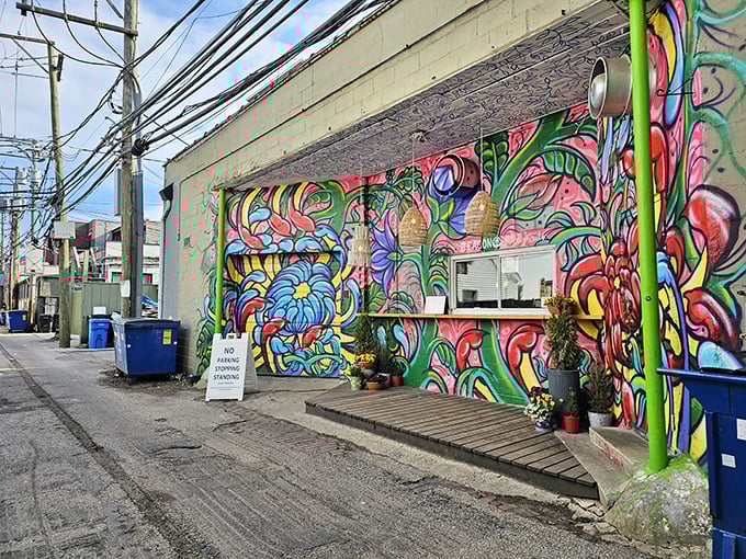 A vibrant explosion of color greets donut seekers in this unassuming alley &ndash; street art and sweet treats making beautiful music together.