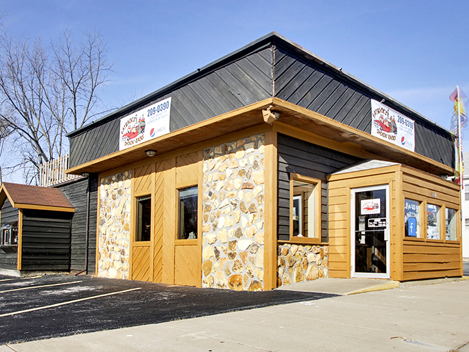 Rustic charm meets serious barbecue business at Fatback's stone-and-wood exterior, where smoke signals beckon hungry travelers from miles around.
