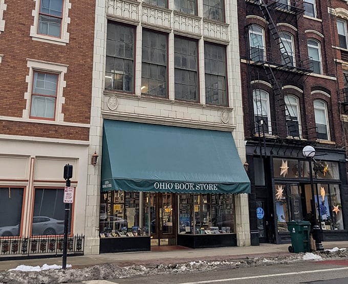 The iconic teal awning of Ohio Book Store stands as a literary beacon on Cincinnati's Main Street, promising adventures beyond the digital realm.