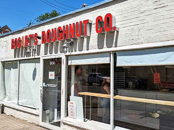 The iconic white brick storefront with bold red lettering beckons doughnut lovers like a lighthouse guiding sugar-seeking ships to safe harbor.