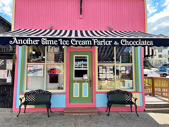 The candy-pink exterior of Another Time Ice Cream Parlor beckons with its striped awning and vintage charm, like a sweet mirage on Lanesboro's main street.