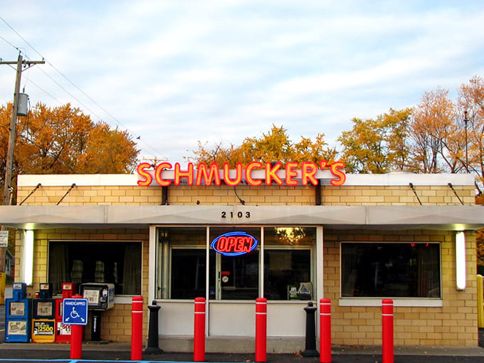 Schmucker's iconic facade glows with vintage charm, its neon sign promising "GOOD FOOD" &ndash; a Toledo landmark since 1948.