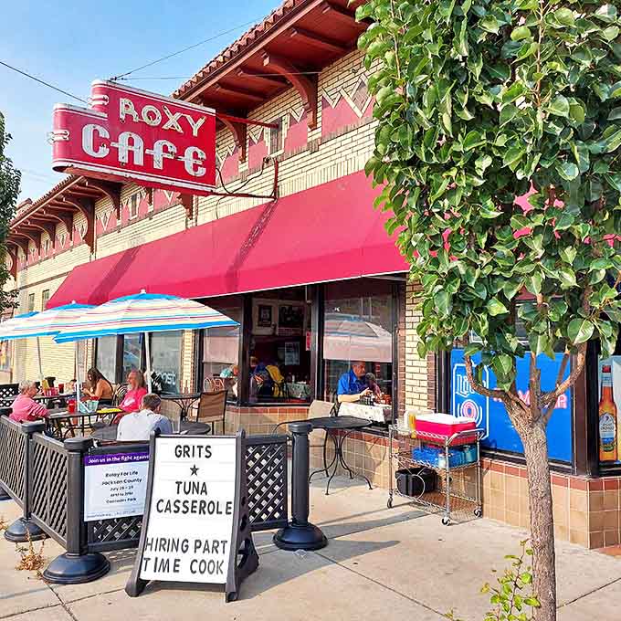 The iconic red neon Roxy Cafe sign beckons hungry visitors like a lighthouse for breakfast lovers, promising comfort food and zero pretension.