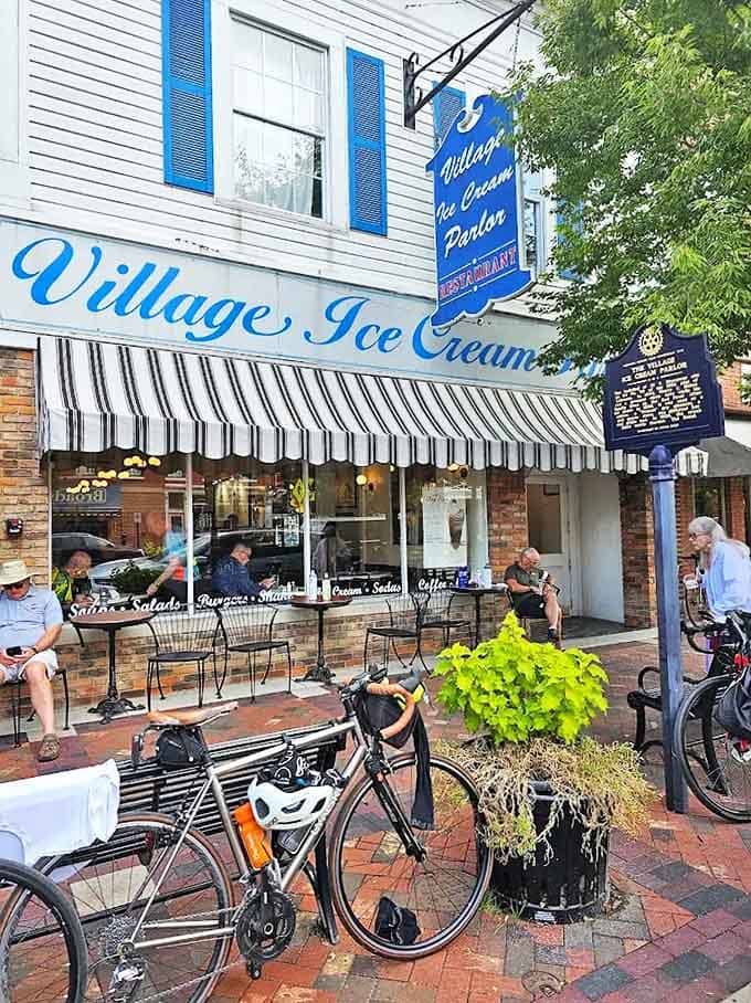 The iconic blue and white façade of Village Ice Cream Parlor beckons like a sweet mirage on Lebanon's South Broadway, promising nostalgic delights within.