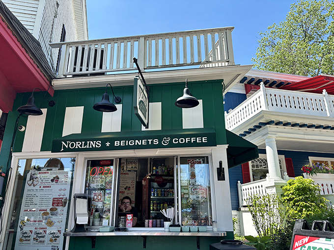 The charming green and white facade of Norlins beckons like a French Quarter oasis in Frankenmuth's Bavarian landscape.