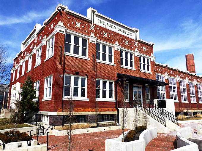 The historic Budd Dairy building stands proudly in Columbus' Italian Village, its red brick facade and decorative white accents hinting at the culinary treasures within.