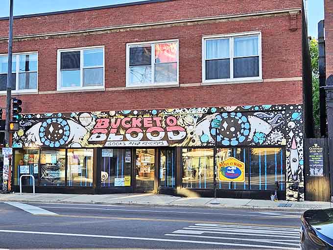 The hypnotic storefront mural pulls you in like a tractor beam for the culturally curious, promising wonders beyond the ordinary.