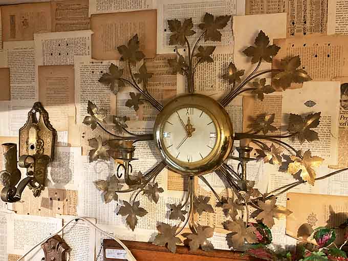 Time literally blossoms on this vintage clock, its golden leaves and elegant face transforming a functional object into a statement piece against aged newspaper pages.