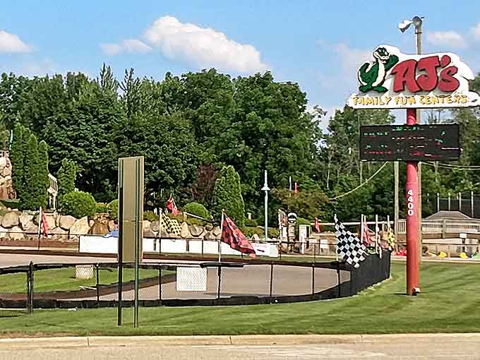 The iconic AJ's sign stands tall against Michigan skies, a beacon of analog fun in our increasingly digital entertainment landscape.
