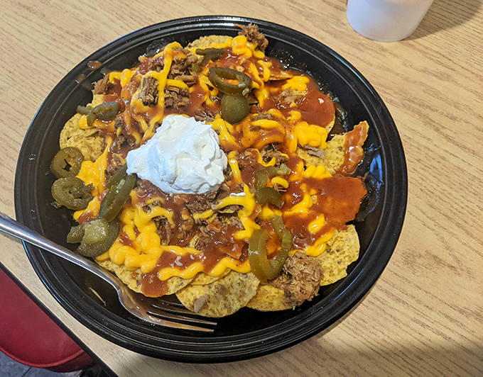 BBQ nachos that break all the rules in the best possible way &ndash; a mountain of chips, meat, cheese, and joy that demands to be shared.