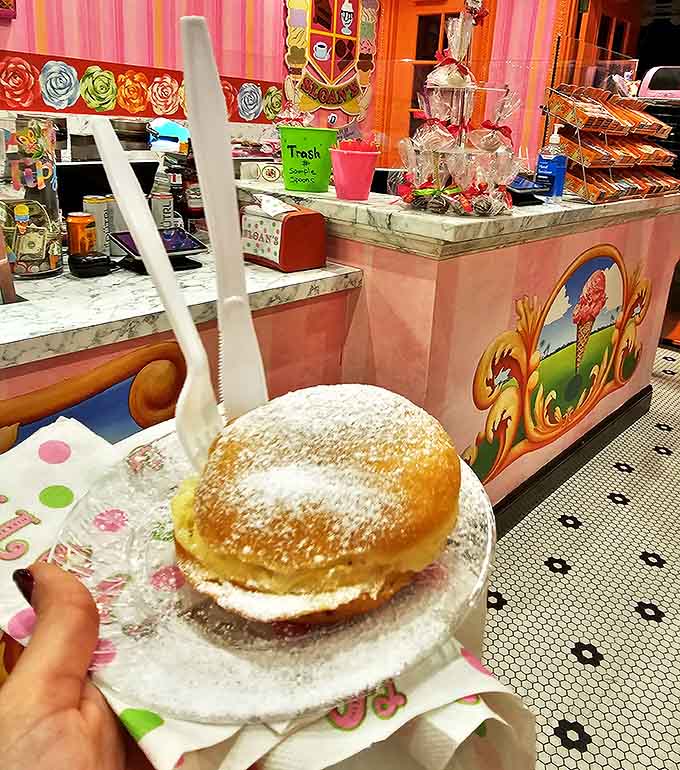A powdered sugar-dusted donut stuffed with ice cream &ndash; proof that two desserts are definitely better than one.