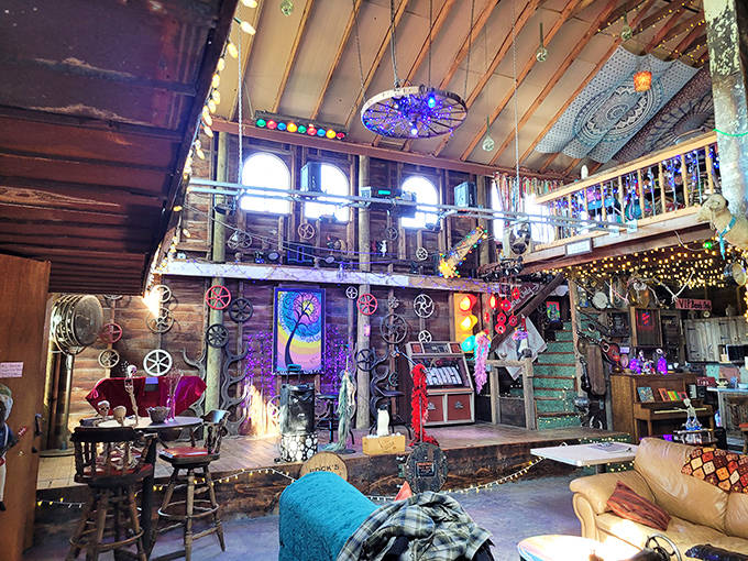 Daylight reveals the full scope of this converted barn, where red metal siding and eclectic charm create an exterior as interesting as what's inside.