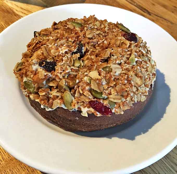 This isn't your average donut &ndash; topped with house-made granola, seeds, and dried fruit, it's breakfast disguised as dessert.