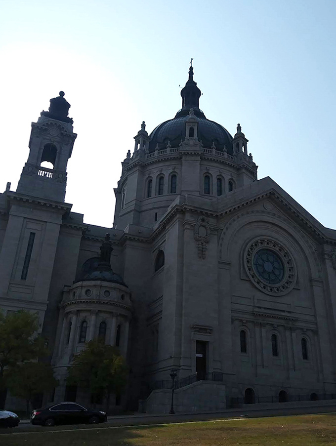 The Cathedral of Saint Paul's majestic dome commands attention from its hilltop perch – a copper-topped exclamation point on the city's skyline.
