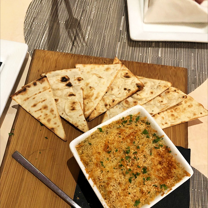 Charcuterie board: Crisp flatbread triangles surround a bubbling dish of savory goodness &ndash; proof that Swedes understand comfort food on a spiritual level.