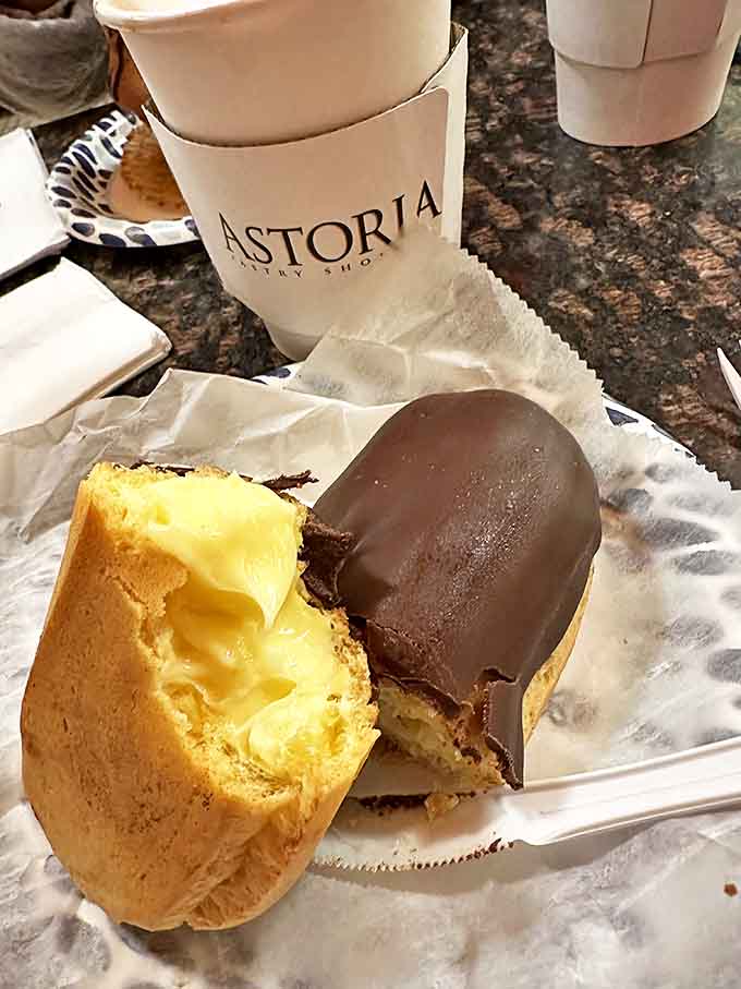 Half-dipped in chocolate, this &eacute;clair doesn't just cross the finish line of deliciousness &ndash; it breaks the tape, shatters records, and makes the crowd go wild.