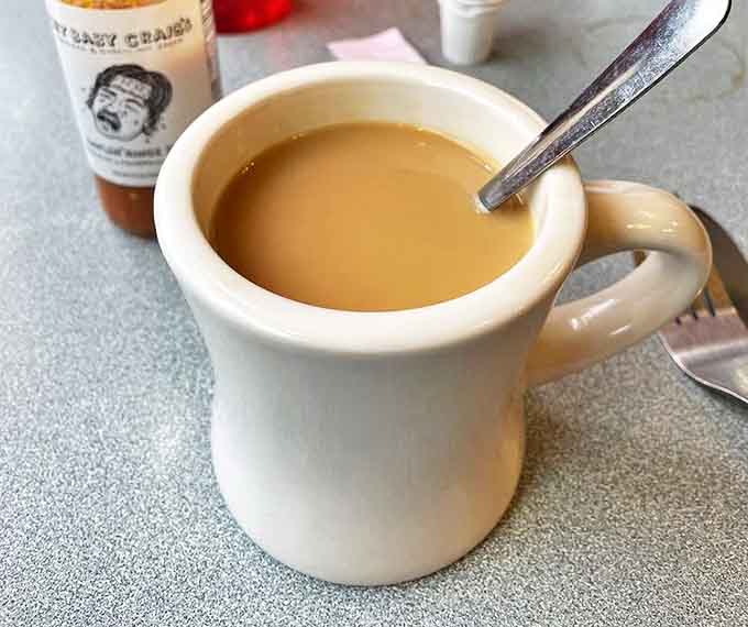 That first sip of diner coffee – strong, honest, and served in a mug substantial enough to warm both hands on chilly Minnesota mornings.