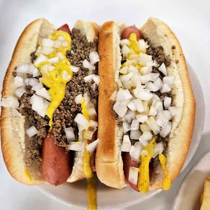 The Coney dog lineup &ndash; these beauties showcase the perfect ratio of chili, mustard and onions that has made them Detroit's favorite fast food.
