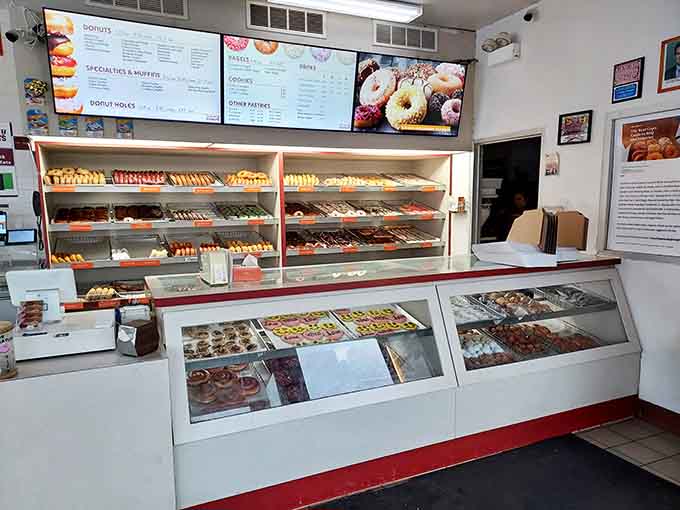 Behind this counter, magic happens daily as skilled hands transform simple ingredients into the stuff of local legend and sugar-fueled dreams.