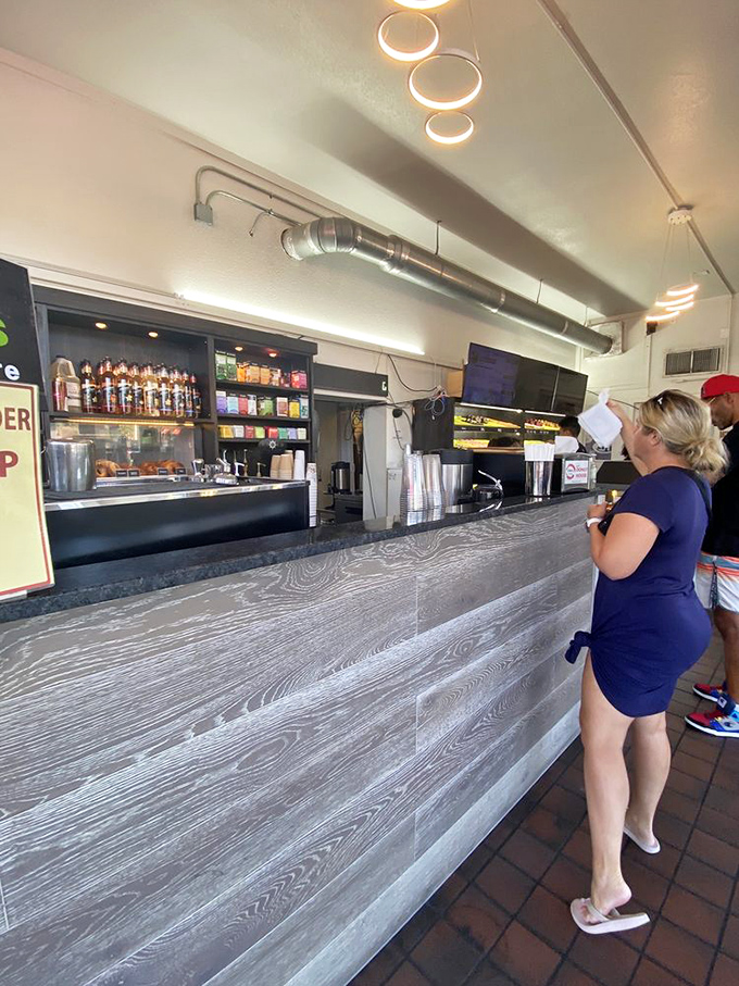 At the counter, the morning ritual unfolds &ndash; orders placed, selections made, and the anticipation building for that first perfect bite.