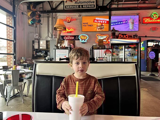 Milkshakes and neon lights! This little guy is ready to enjoy some classic diner vibes and a cool drink at Chloe's!