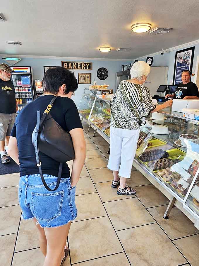 Customers contemplating their options face the eternal struggle: practical restraint versus unbridled dessert enthusiasm.