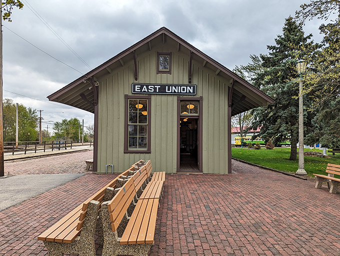 East Union station stands as a perfectly preserved time capsule, its simple green clapboard design welcoming visitors just as it did passengers decades ago.