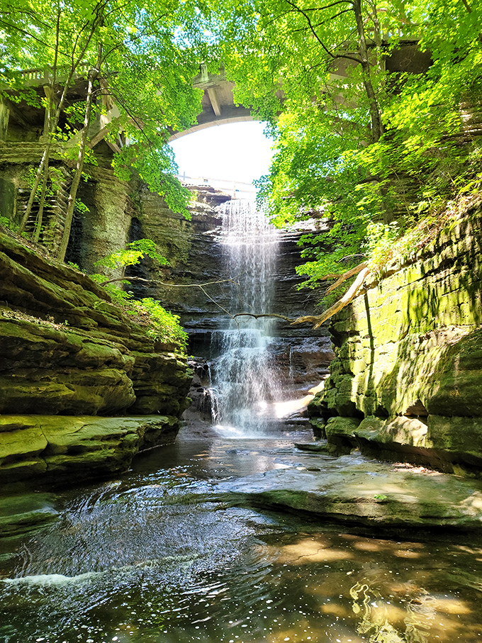 Matthiessen's crown jewel reveals itself as water dances down rock faces carved over millennia, creating nature's perfect cooling system.