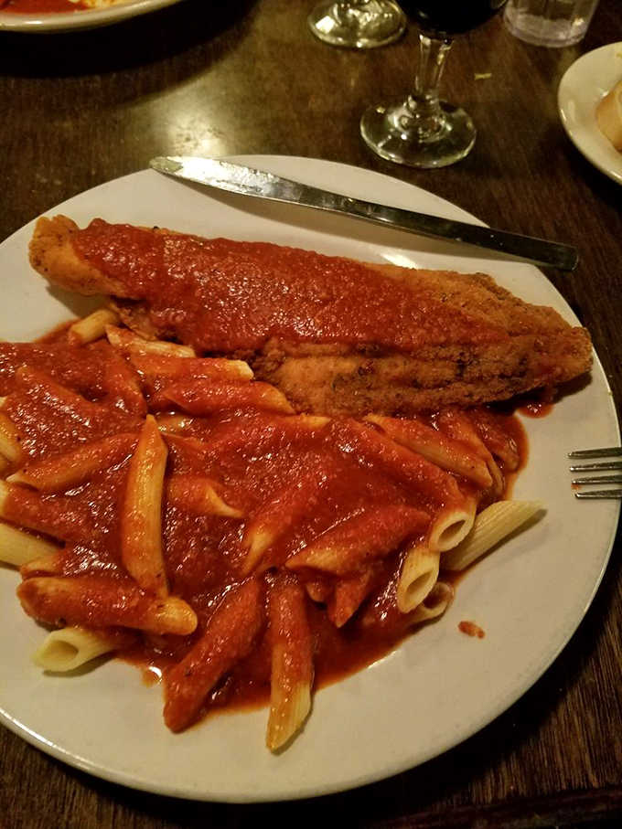 Fried catfish swimming in red sauce proves that Italian-American cuisine isn't afraid to venture beyond tradition into deliciously unexpected territory.