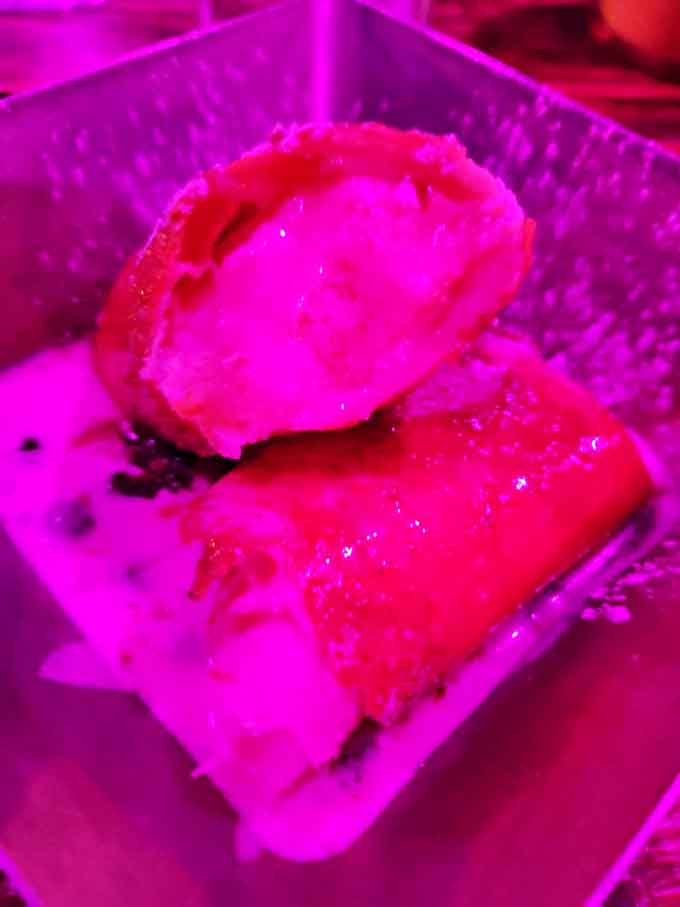 Dessert gets the boozy treatment with these fried cheesecake bites, their crisp exterior giving way to creamy centers infused with spirits.