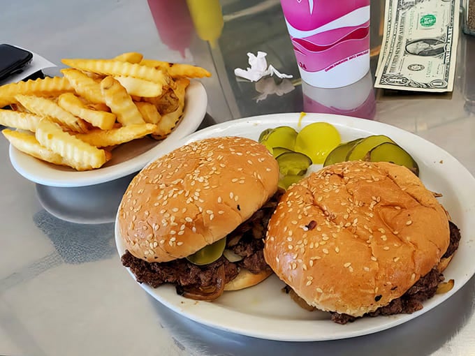 Two perfectly grilled burgers with those signature caramelized onions&mdash;proof that simplicity, when executed flawlessly, beats complexity every time.