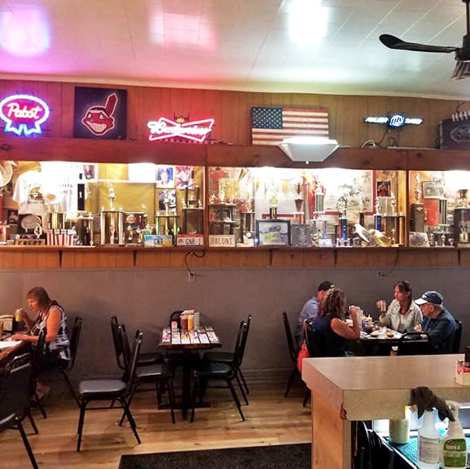 Sports memorabilia lines the walls as diners enjoy meals without checking their phones &ndash; a scene increasingly rare in our digital world.