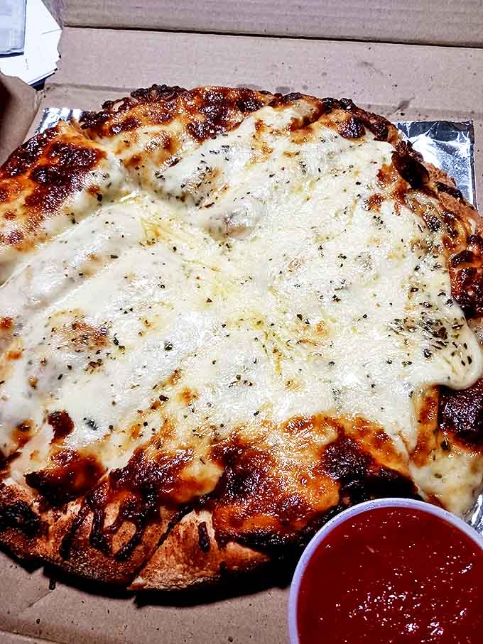 Garlic cheese bread that makes you question whether you even need to order pizza &ndash; a perfect balance of crisp exterior and gooey interior.
