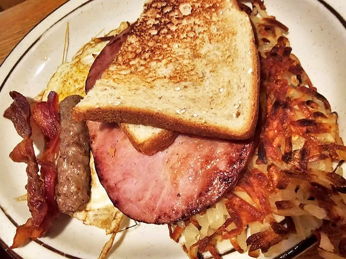 The savory waffle option loaded with cheese, bacon, and a dollop of sour cream offers a hearty alternative for those who prefer breakfast with attitude.