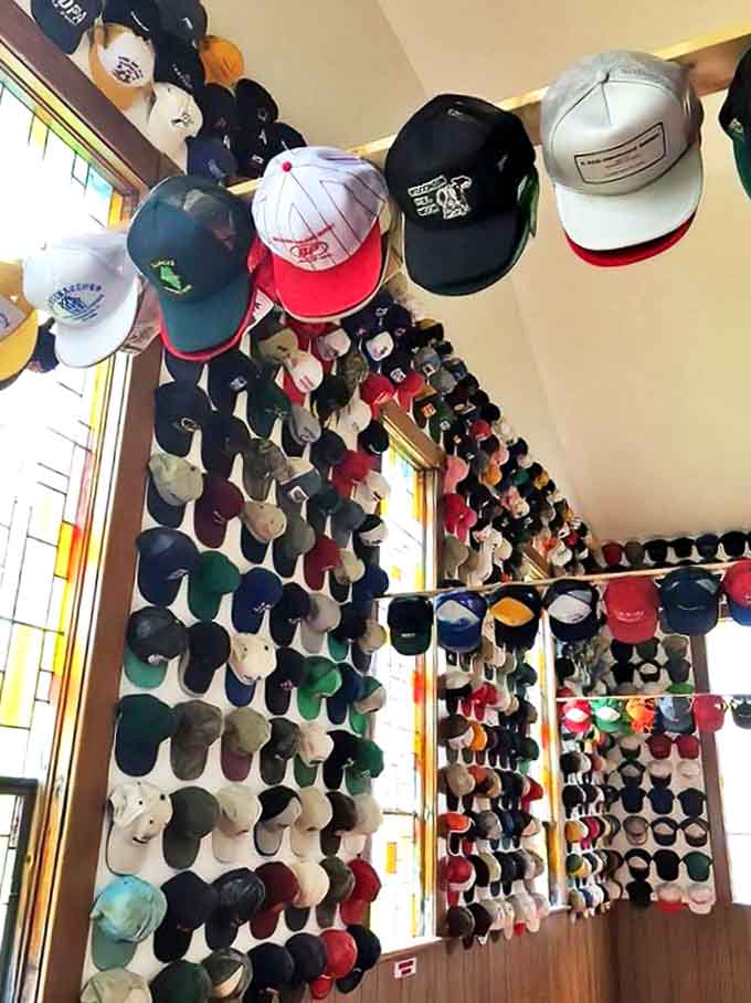 The ceiling becomes a canvas for caps, creating a colorful canopy that transforms the space into a cathedral of collecting.