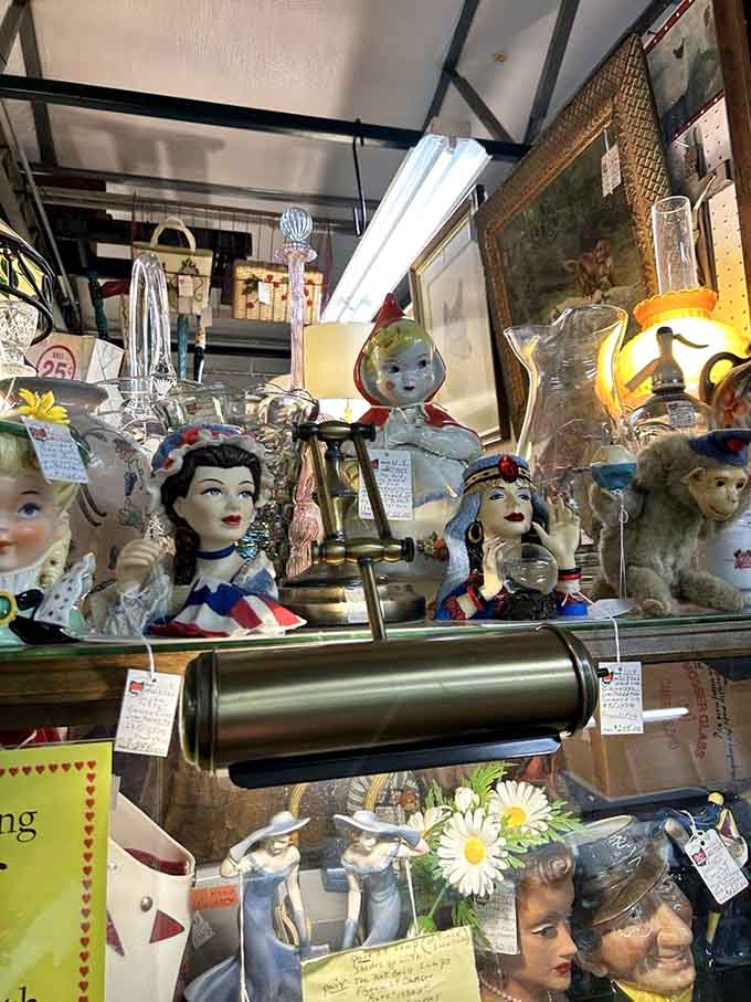 Vintage head vases stare at you with their painted smiles, because nothing says "planter" like a disembodied head.