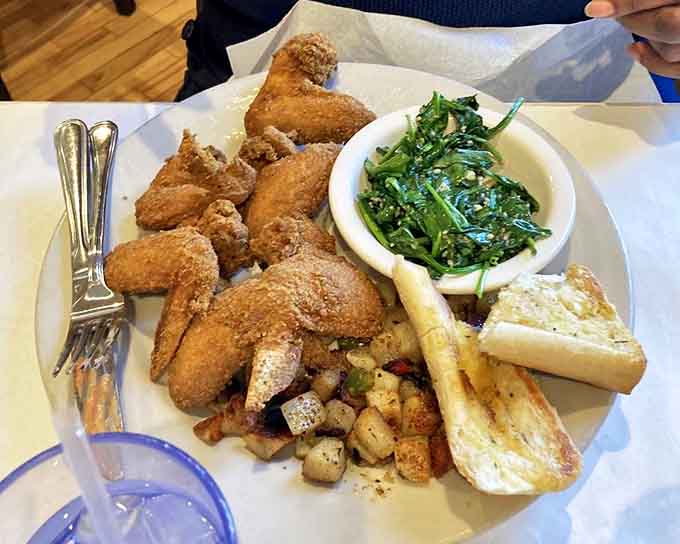 These aren't just any wings &ndash; they're crispy Southern ambassadors served with collard greens so good, they might make you reconsider your vegetable prejudices.